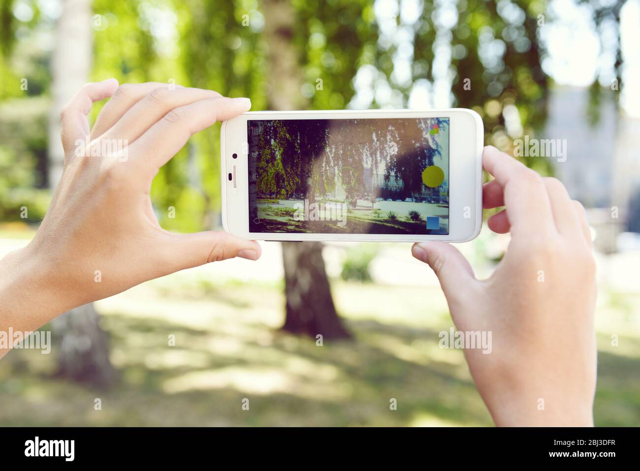 Human hands taking photo with mobile phone, outdoors Stock Photo - Alamy