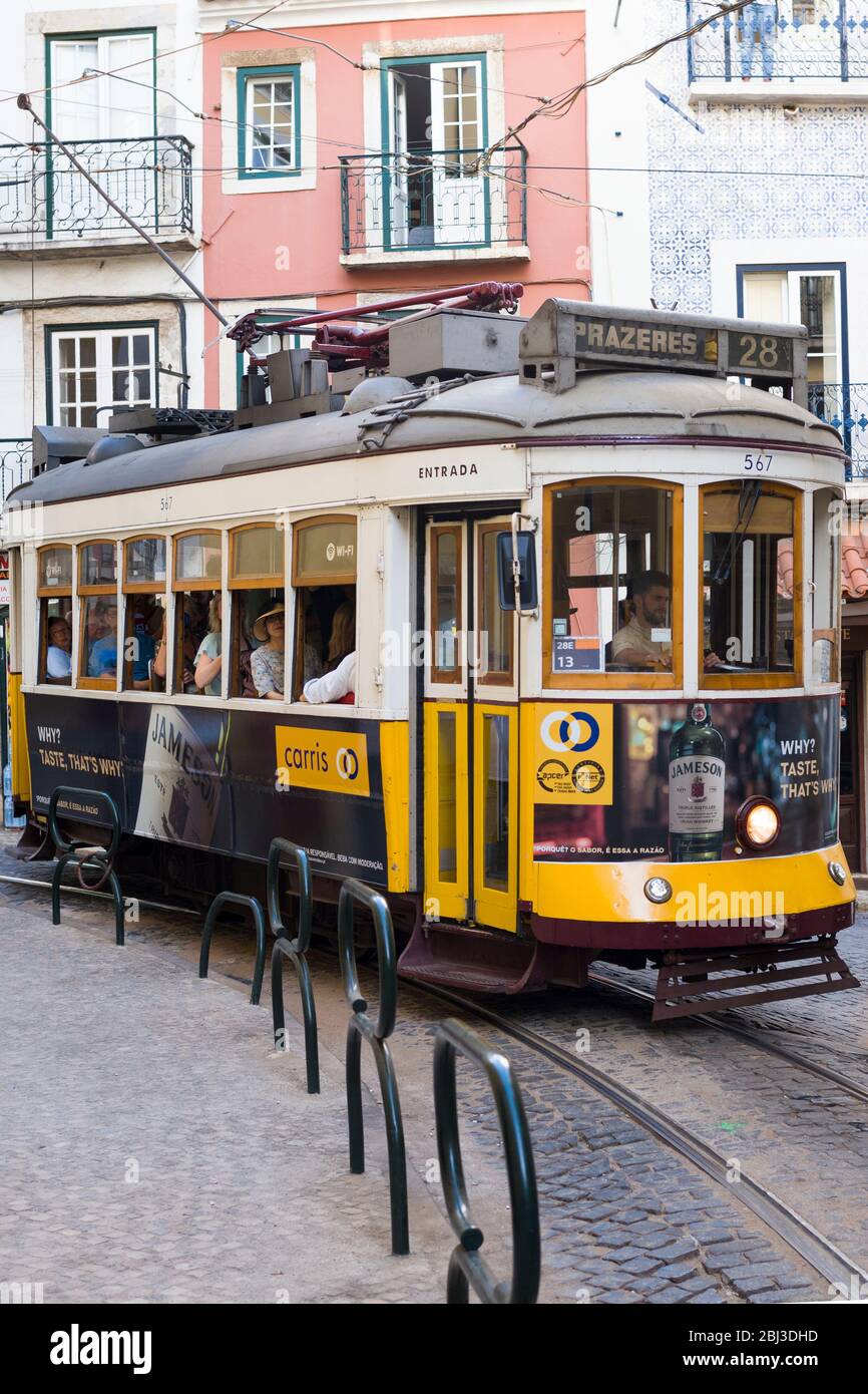 Historic famous number 28 tram carrying local people and tourists on ...