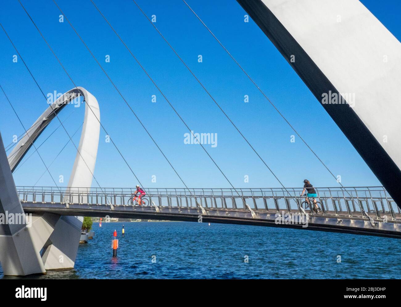 Cyclists riding their bikes over the Elizabeth Quay Bridge a pedestrian ... Cyclists riding their bikes over the Elizabeth Quay Bridge a pedestrian ...