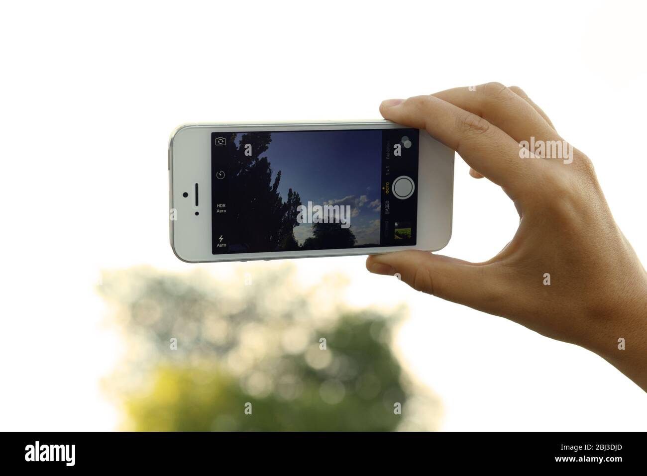 Human hand taking photo with mobile phone, outdoors Stock Photo - Alamy