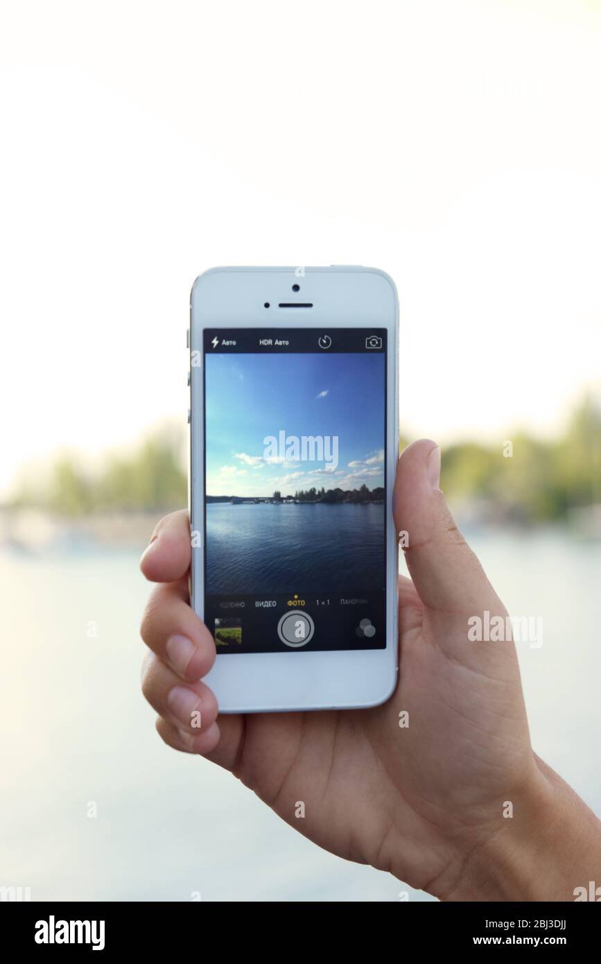 Human hand taking photo with mobile phone, outdoors Stock Photo - Alamy