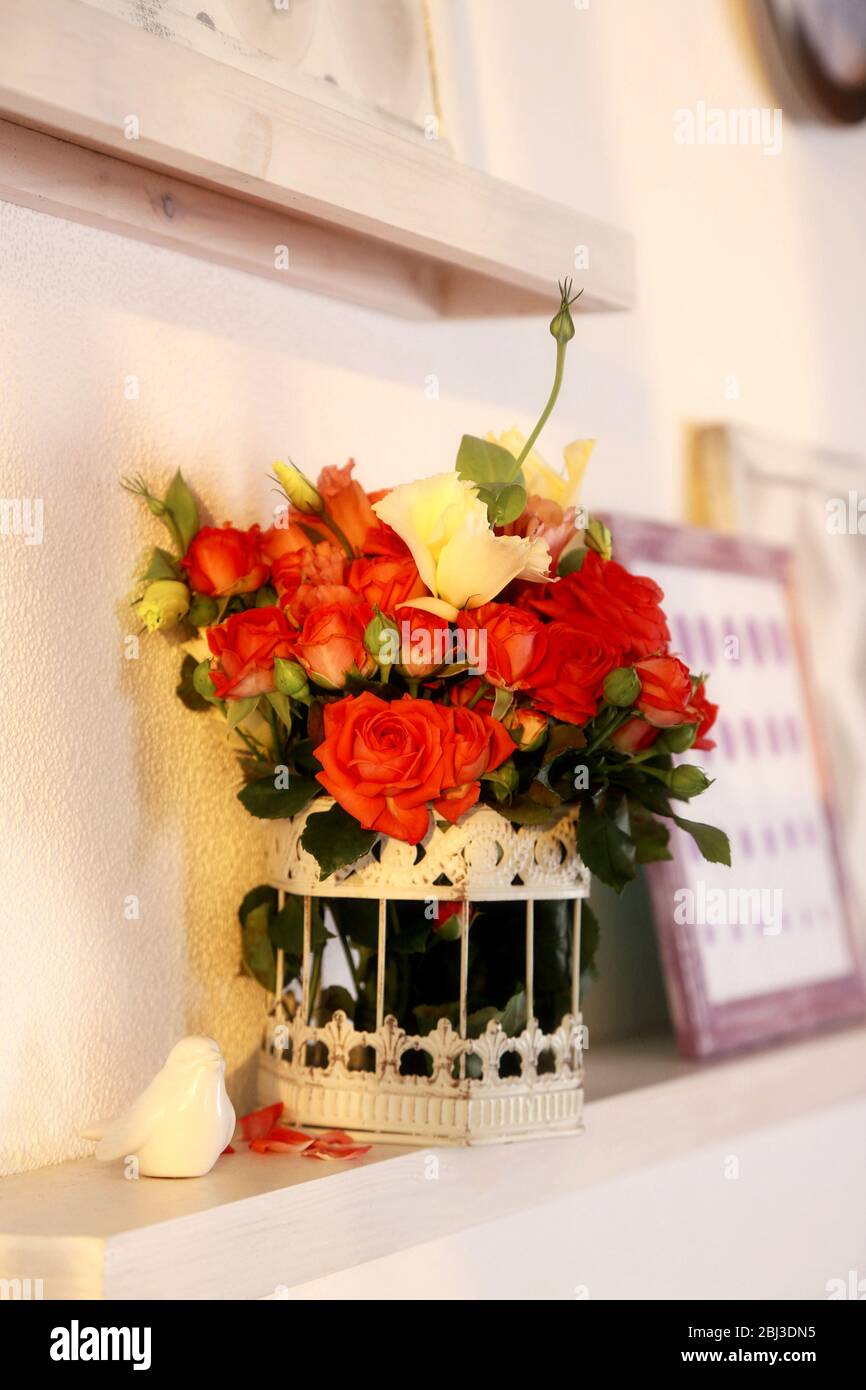 Beautiful rose in vase on shelf Stock Photo - Alamy