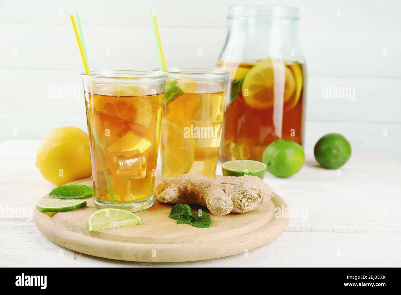 Iced tea with lemon on light wooden background Stock Photo - Alamy
