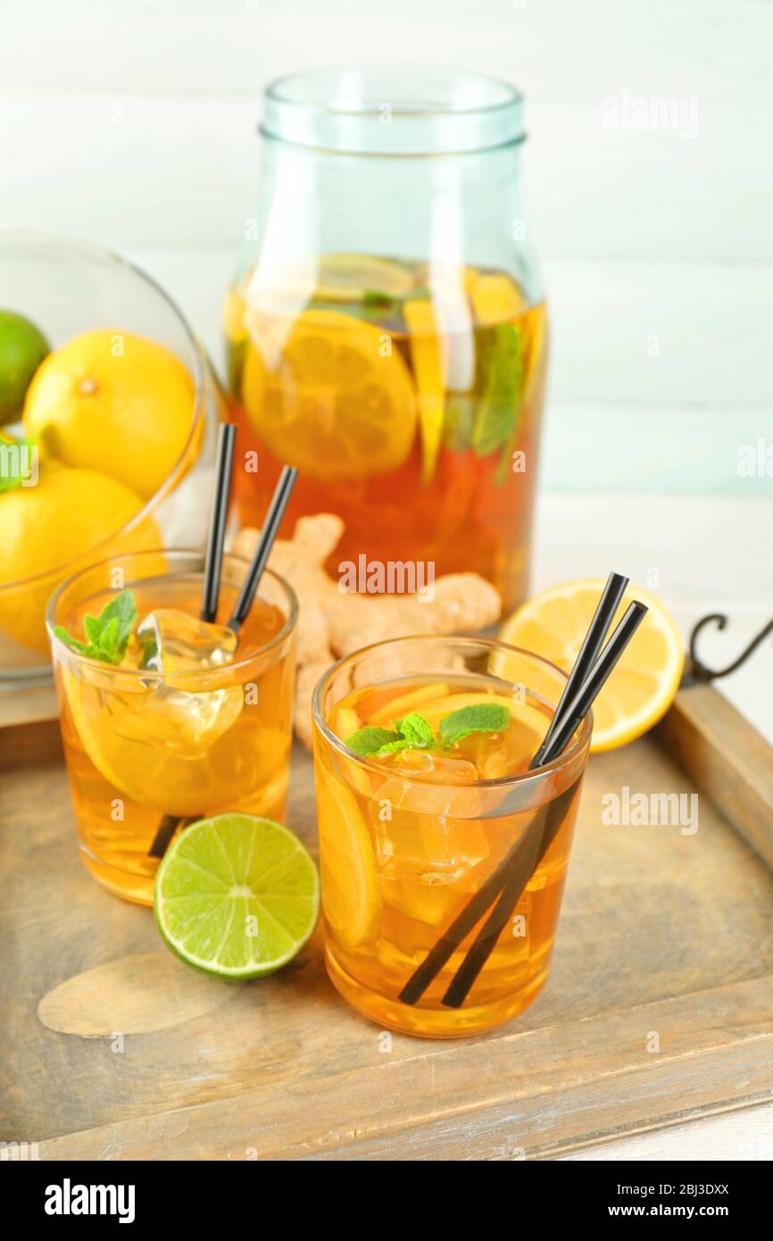 Iced tea with lemon on light wooden background Stock Photo - Alamy