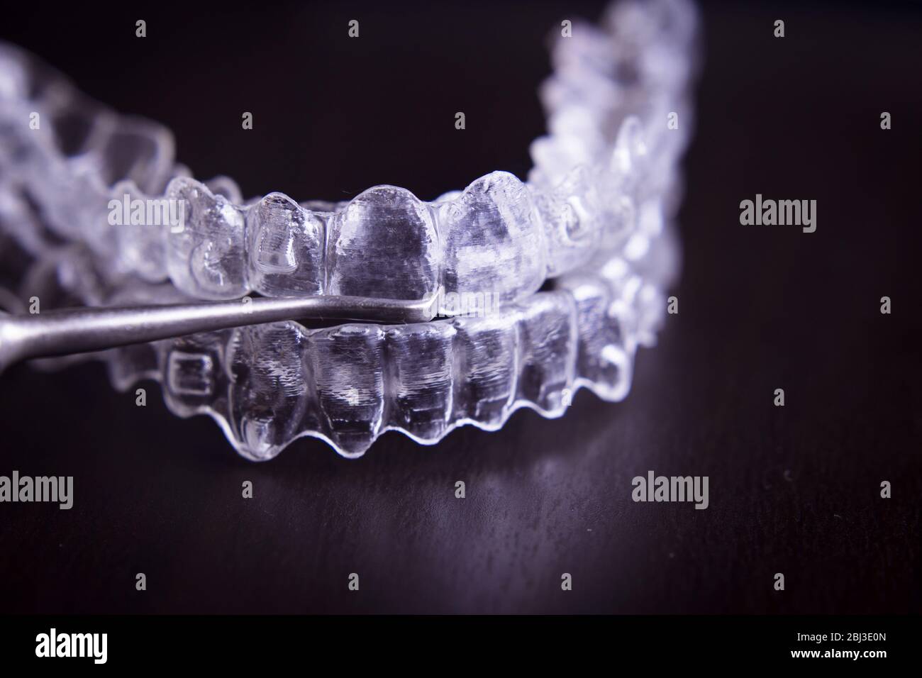 Transparent plastic dental retainer teeth alignment corrector with ...