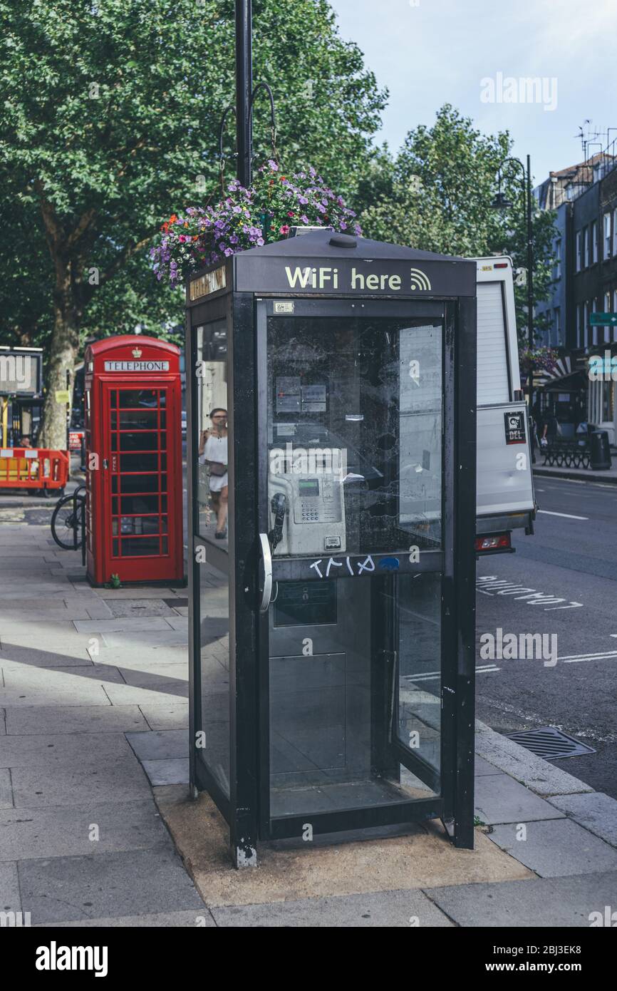 London/UK-1/08/18: Traditional telephone boxes on a street in London ...