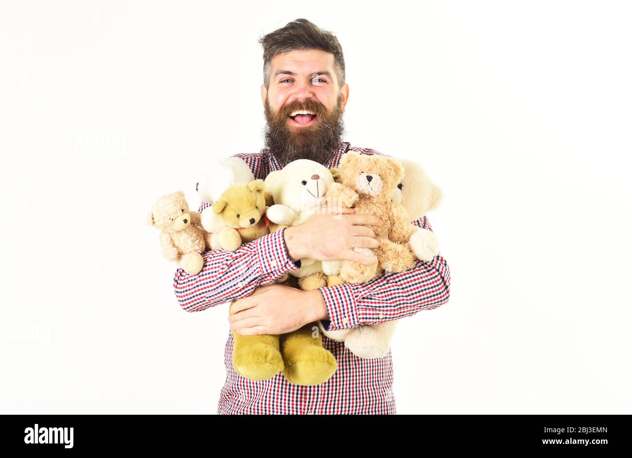 Gifts and holidays concept. Macho with beard hugs many teddy bears and ...