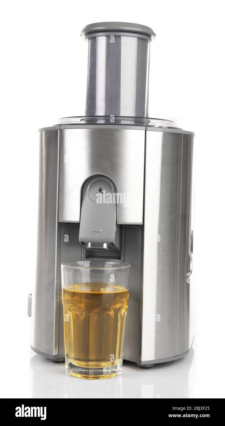 Stainless juice extractor with glass of juice isolated on white ...