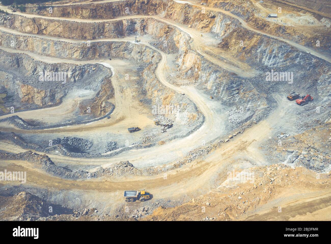 Mining from above. Industrial terraces on open pit mineral mine. Aerial ...