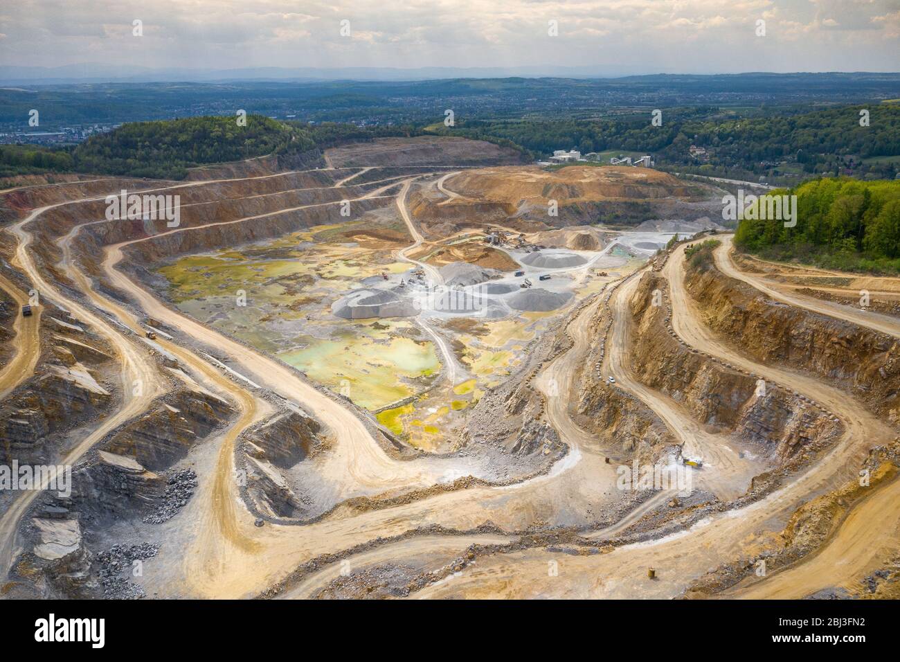 Mining from above. Industrial terraces on open pit mineral mine. Aerial ...