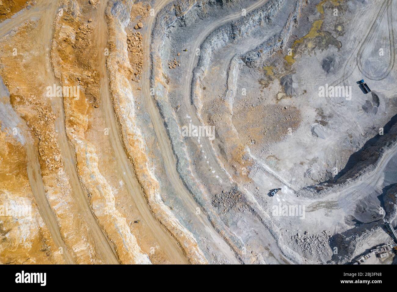 Mining from above. Industrial terraces on open pit mineral mine. Aerial ...