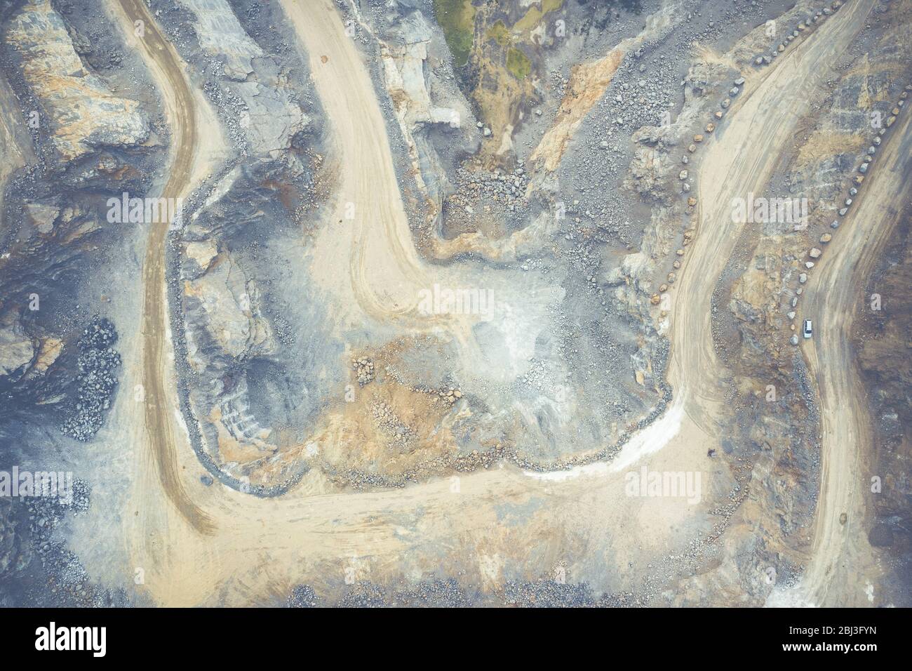 Mining from above. Industrial terraces on open pit mineral mine. Aerial ...