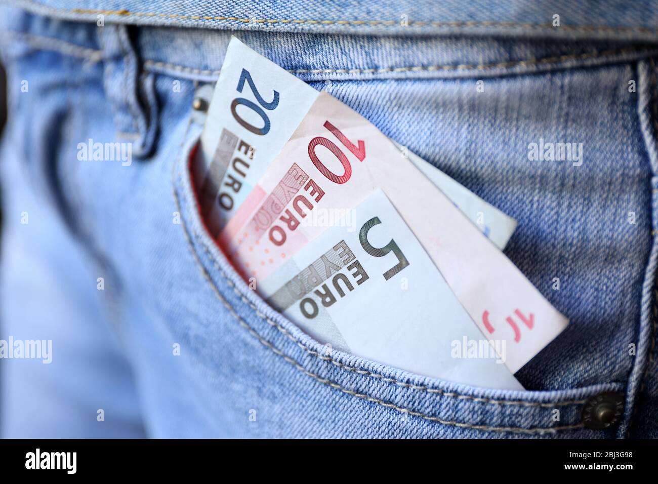 Euro banknotes in jeans pocket closeup Stock Photo - Alamy