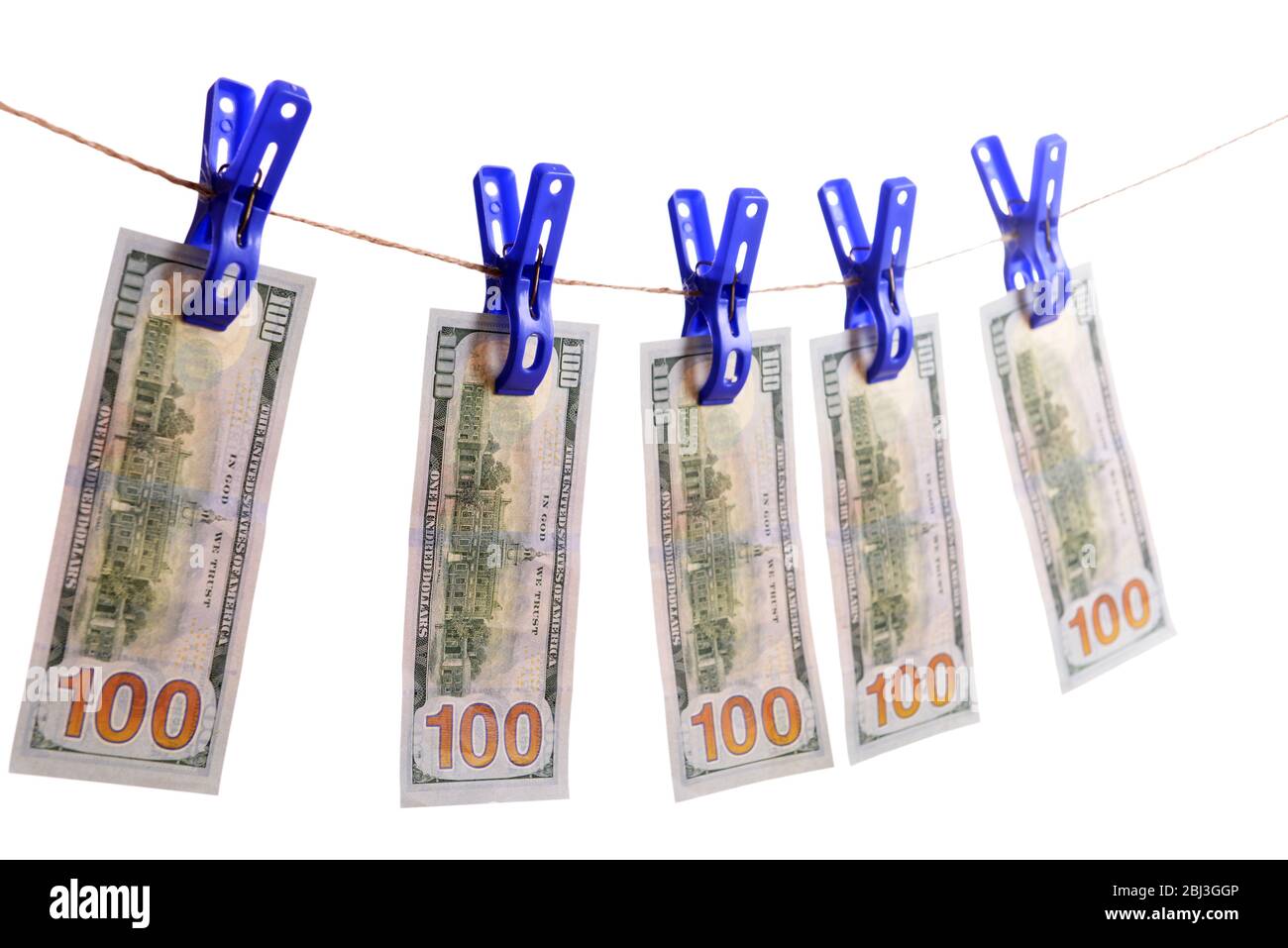 Concept of money laundering - dollars are drying on cord isolated on ...