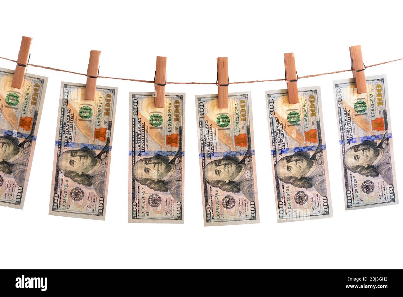 Concept of money laundering - dollars are drying on cord isolated on ...