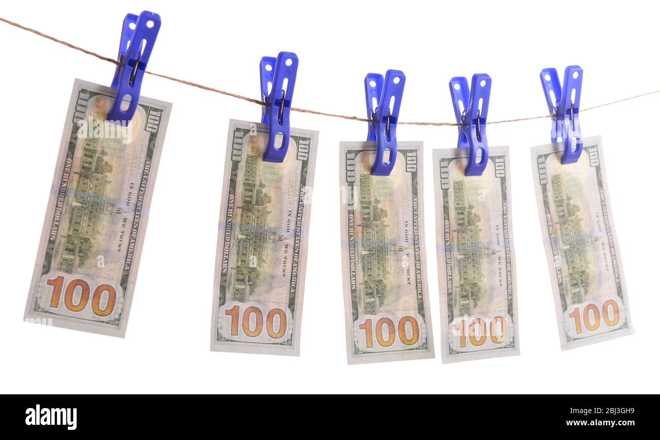 Concept of money laundering - dollars are drying on cord isolated on ...