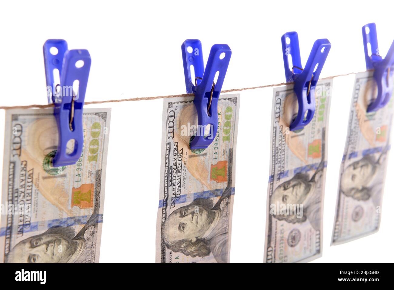 Concept of money laundering - dollars are drying on cord isolated on ...