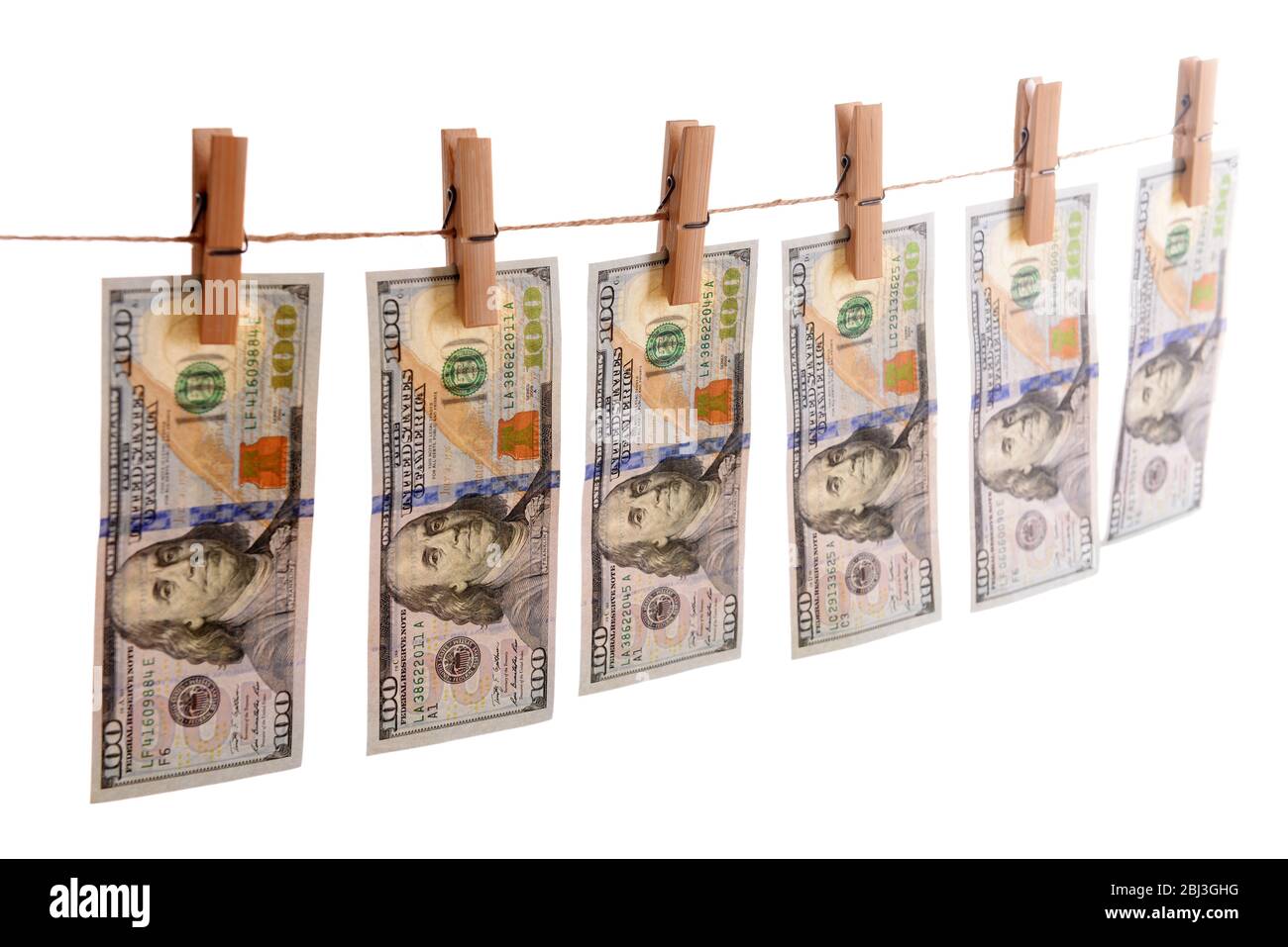 Concept of money laundering - dollars are drying on cord isolated on ...