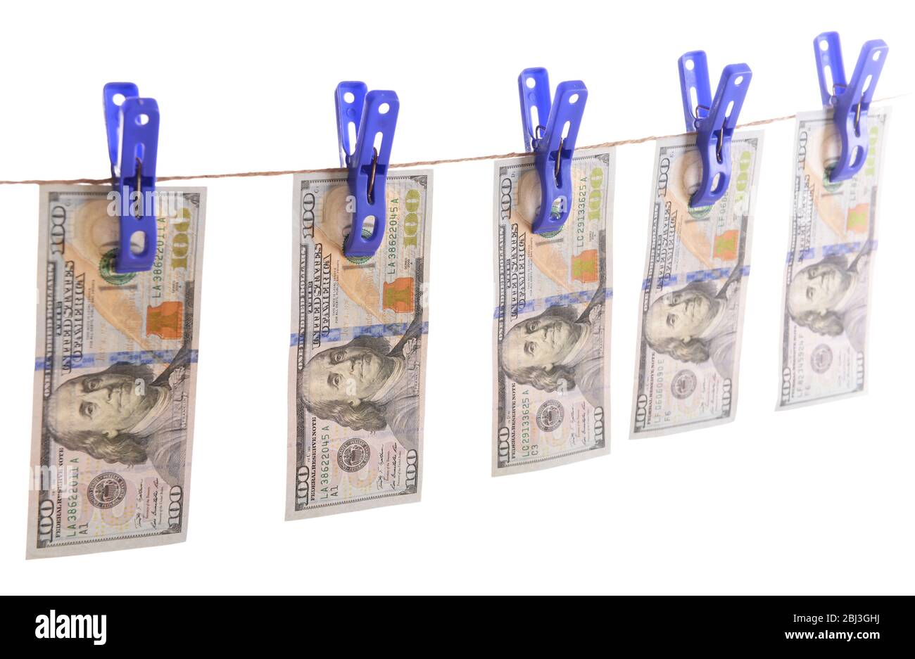 Concept of money laundering - dollars are drying on cord isolated on ...