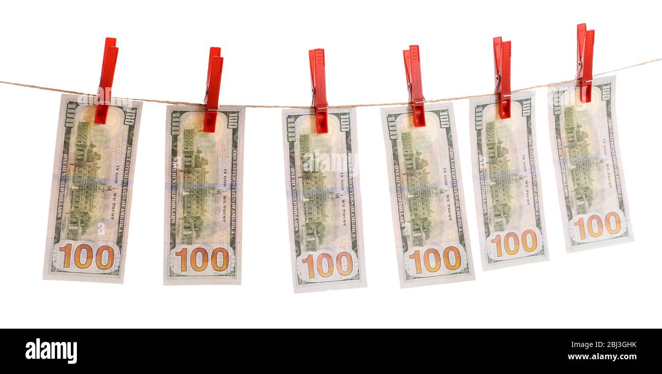 Concept of money laundering - dollars are drying on cord isolated on ...