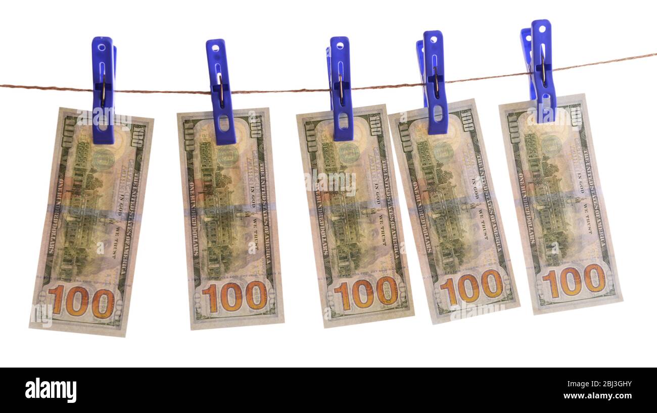 Concept of money laundering - dollars are drying on cord isolated on ...