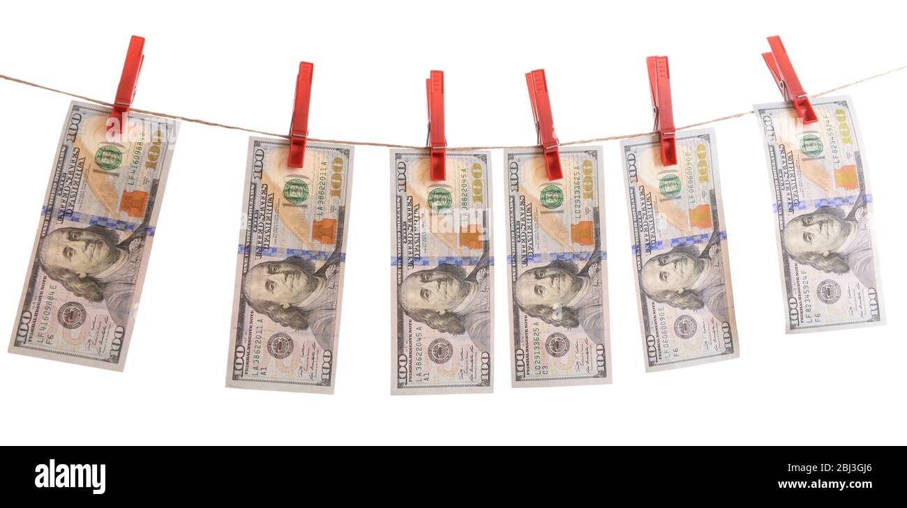 Concept of money laundering - dollars are drying on cord isolated on ...