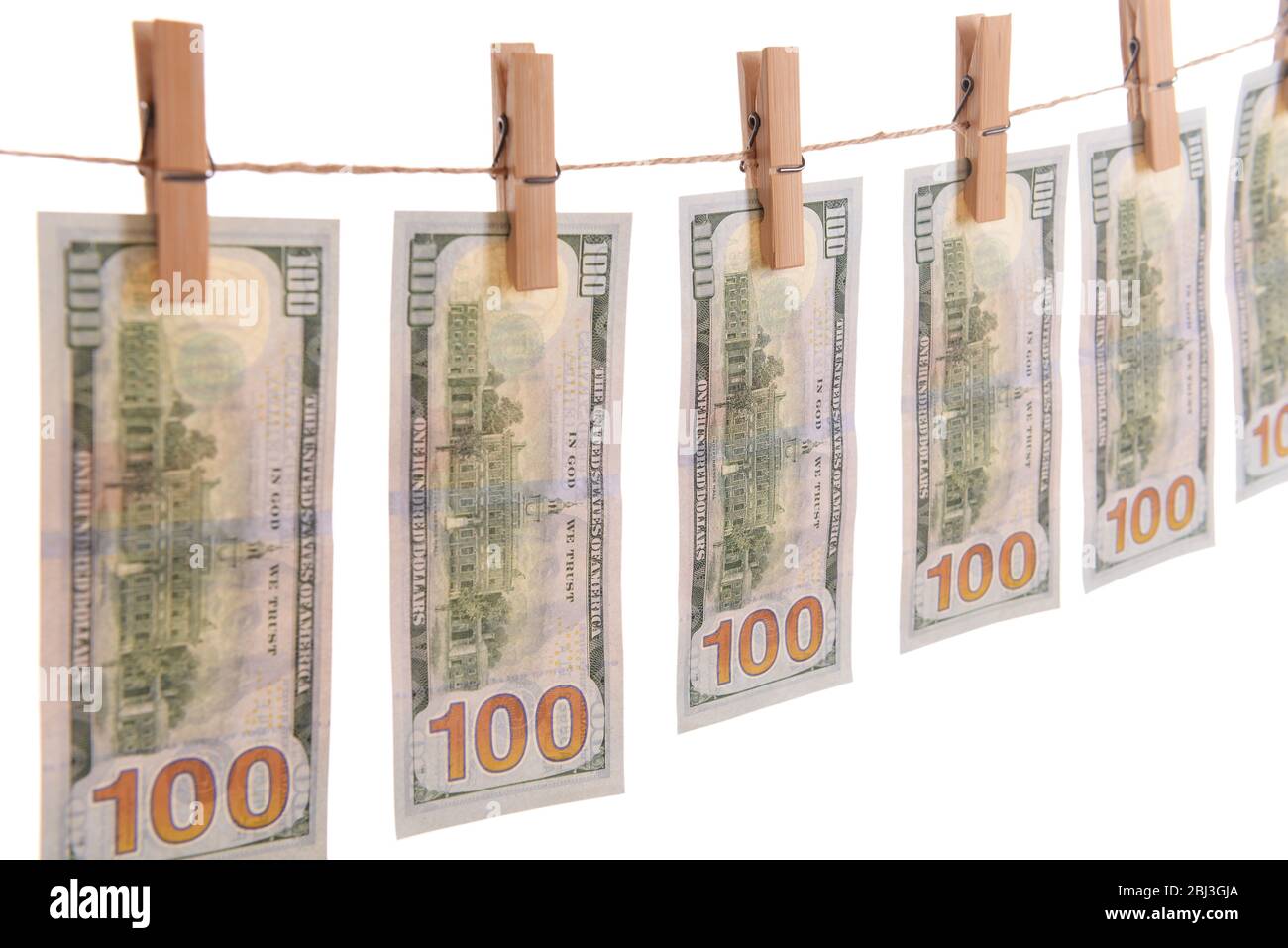 Concept of money laundering - dollars are drying on cord isolated on ...