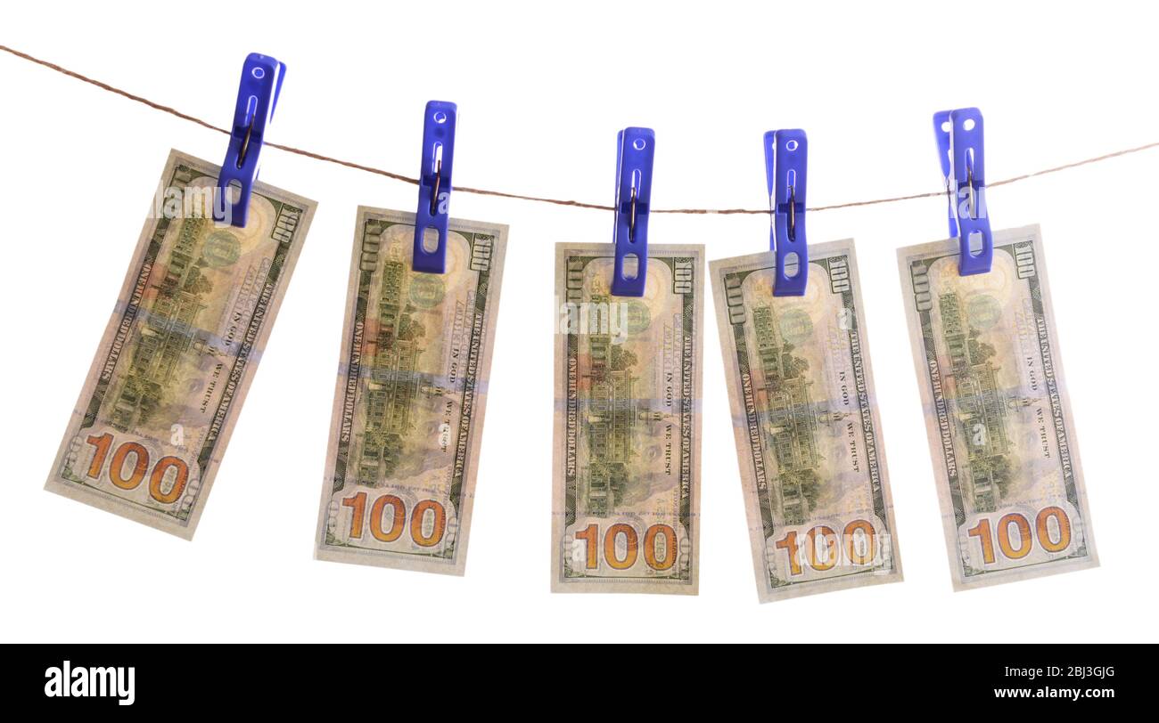 Concept of money laundering - dollars are drying on cord isolated on ...