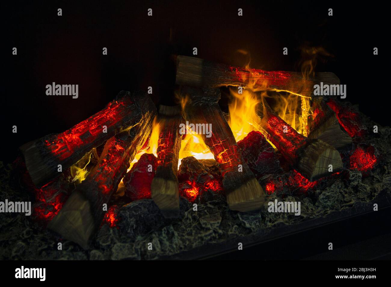 Bright fire burns in a fireplace. Homeliness Stock Photo - Alamy