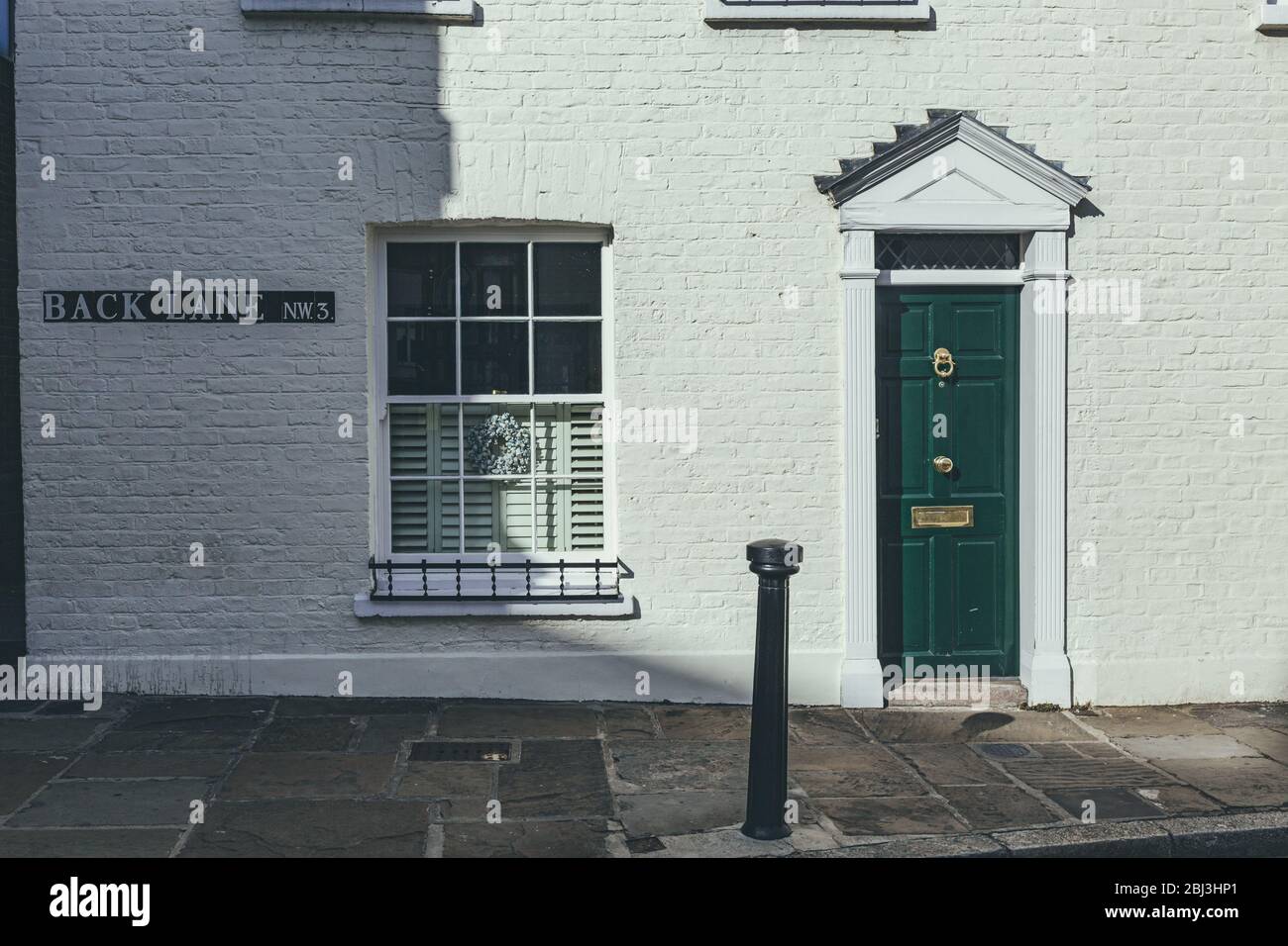 London/UK-1/08/18: colorful green door on a facade of a typical British ...