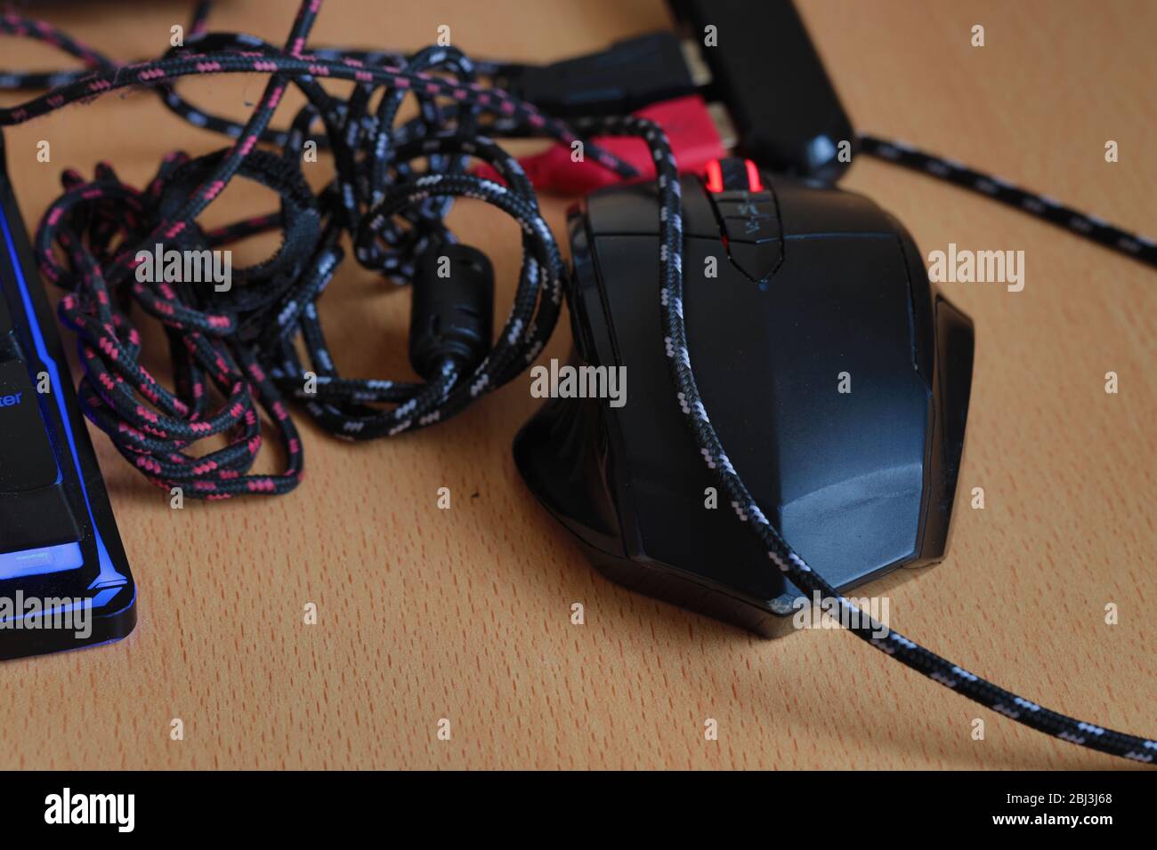 Concept consisting of mouse, keyboard and cables. Cables tangled ...