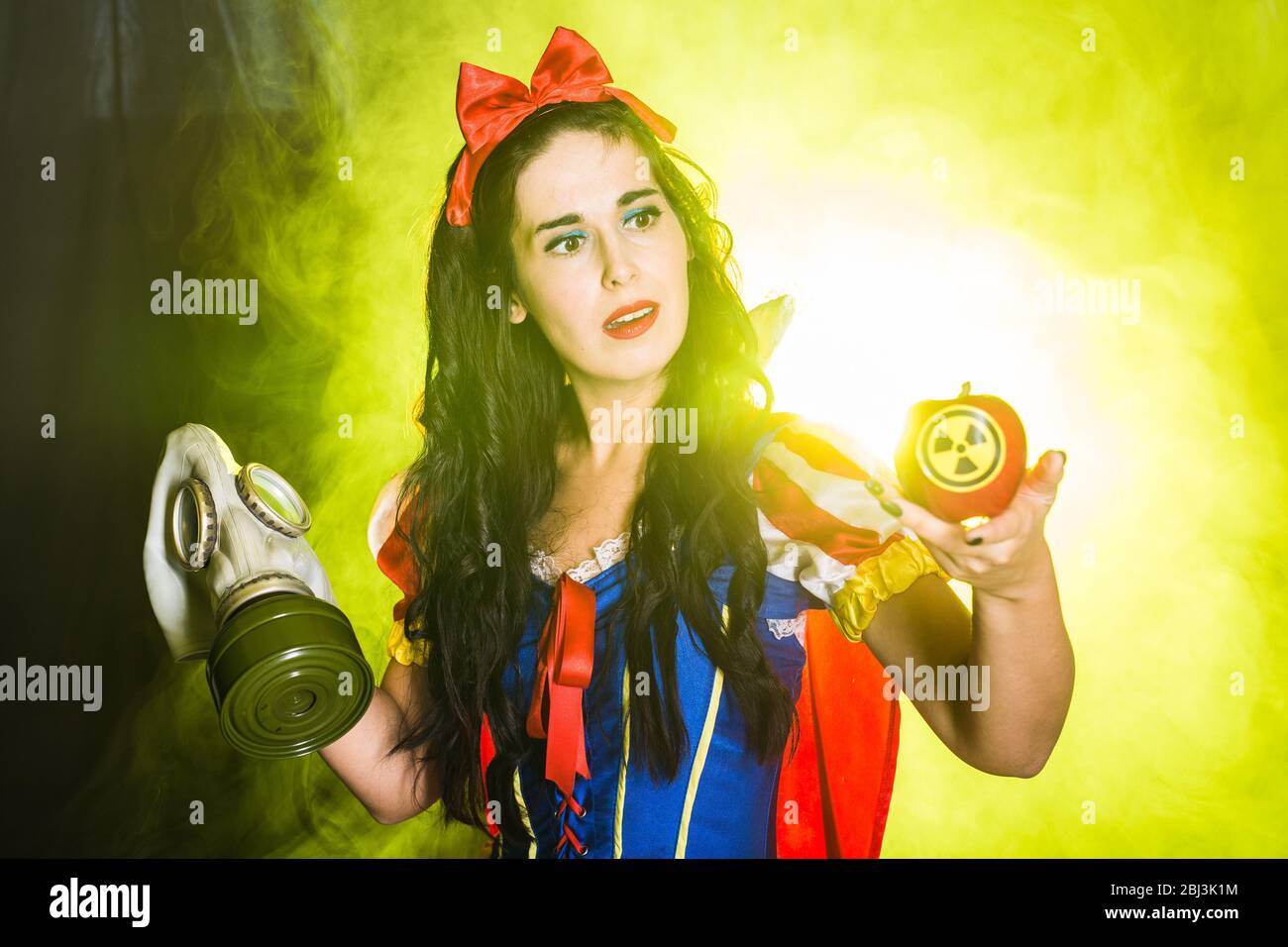 Woman holding hazardous radioactive apple. Nuclear and radiation ...