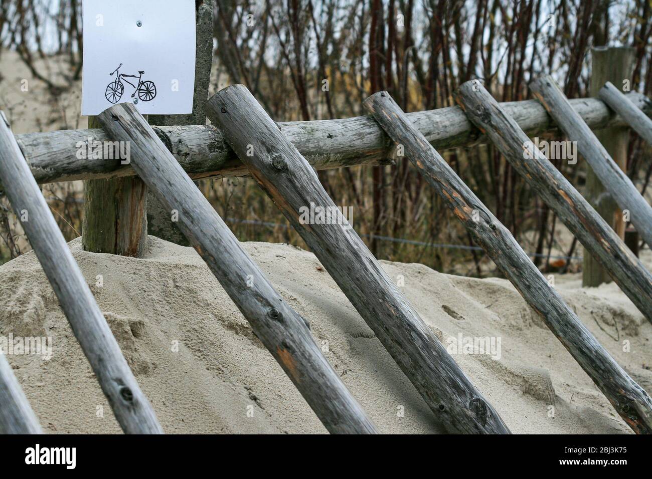 Rustic timber cycle stand Stock Photo - Alamy
