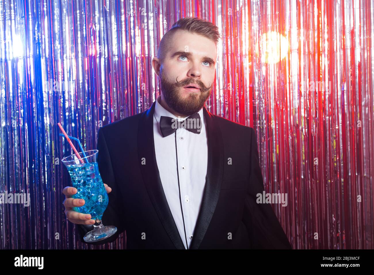 Alcoholism, fun and fool concept - Drunk guy at party in a nightclub ...