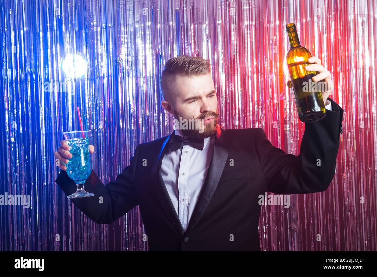 Alcoholism, fun and fool concept - Drunk crazy guy at party in a ...