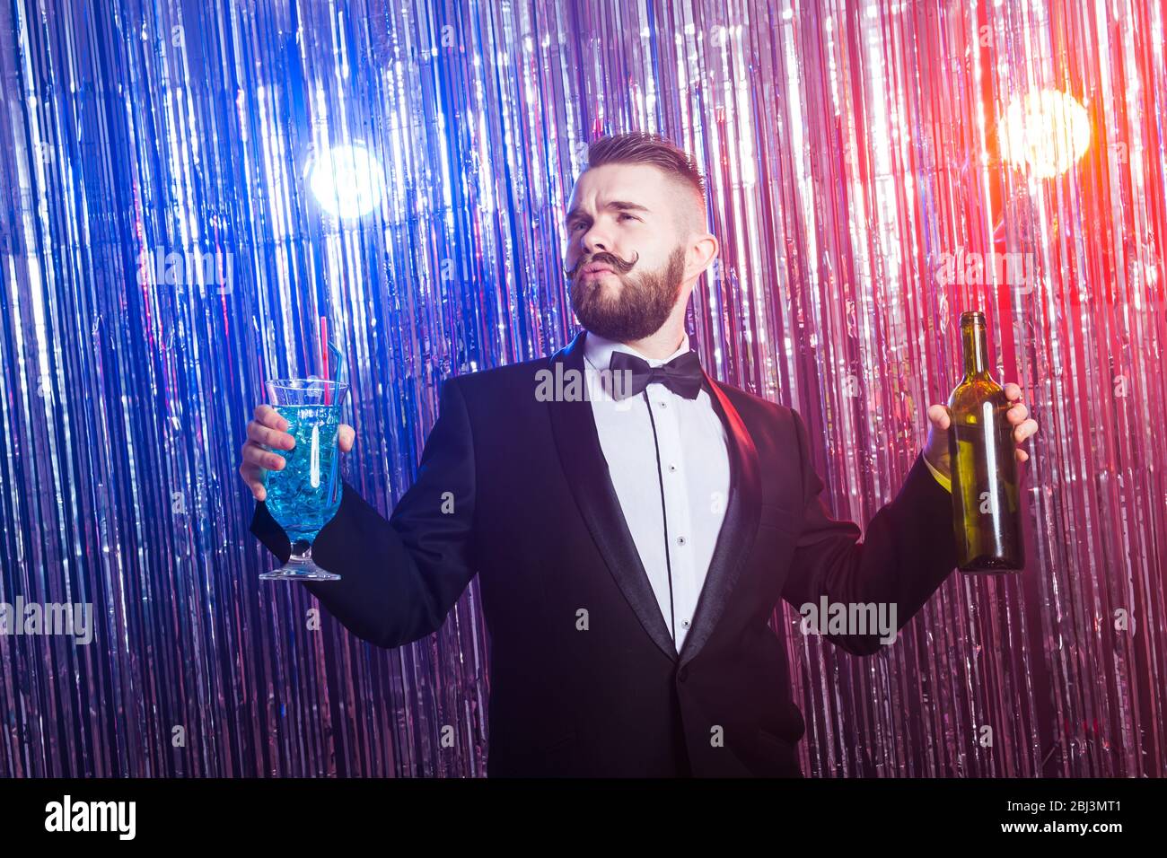 Alcoholism, fun and fool concept - Drunk man at party in a nightclub ...