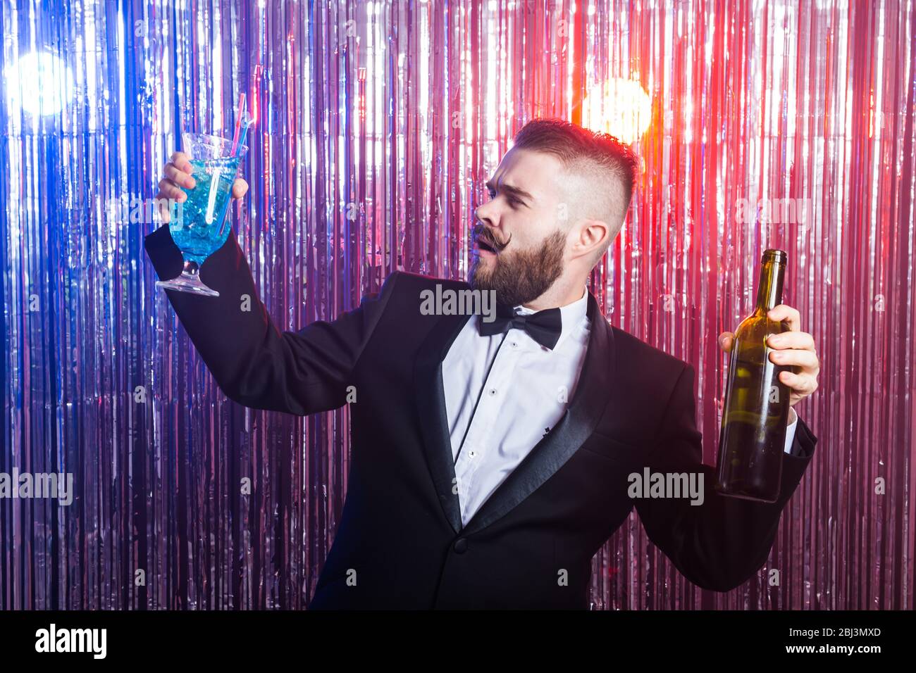 Alcoholism, fun and fool concept - Drunk crazy guy at party in a ...