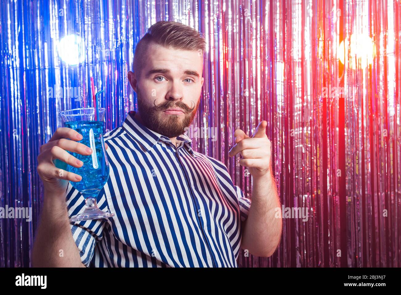 Alcoholism, fun and fool concept - Drunk guy at party in a nightclub ...
