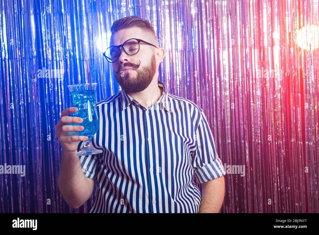 Alcoholism, fun and fool concept - Drunk guy at party in a nightclub ...