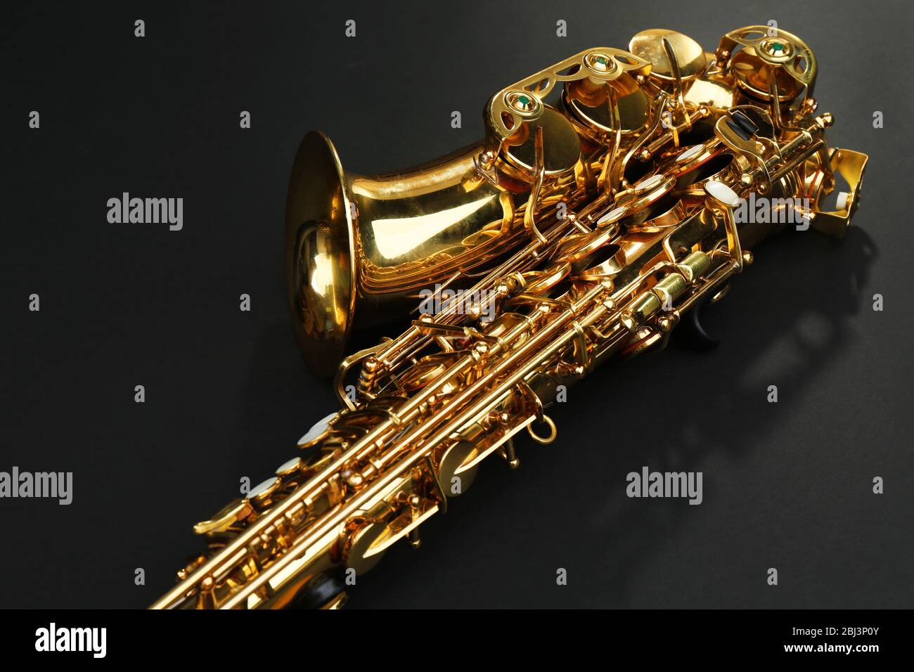 Beautiful golden saxophone on black background, close up Stock Photo ...