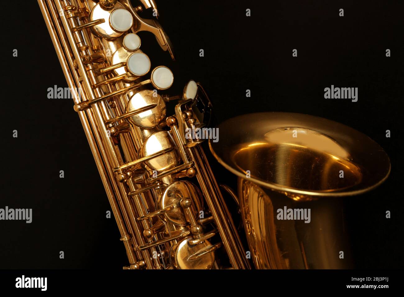 Beautiful golden saxophone on black background, close up Stock Photo ...