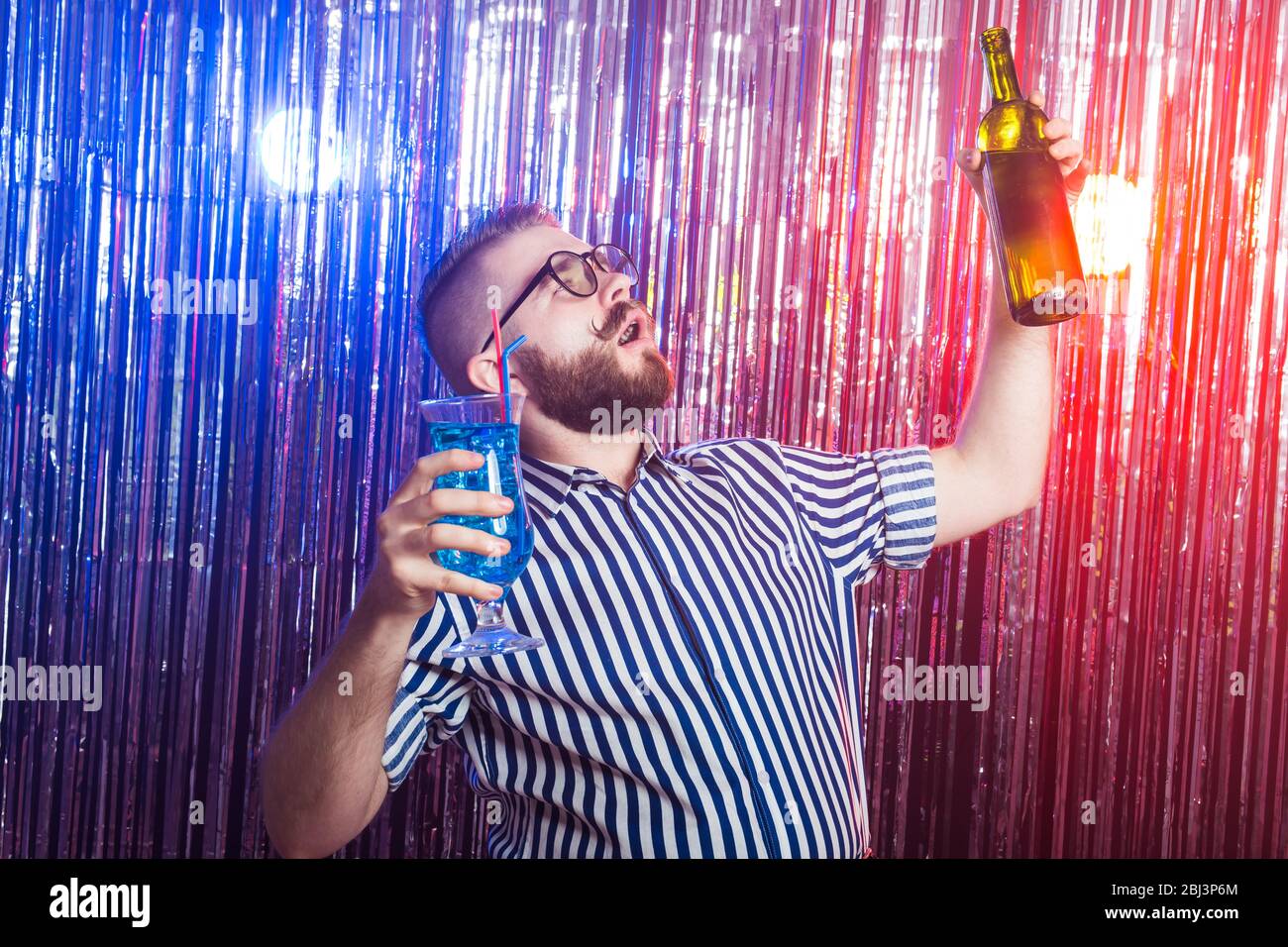 Alcoholism, fun and fool concept - Drunk guy at party in a nightclub ...