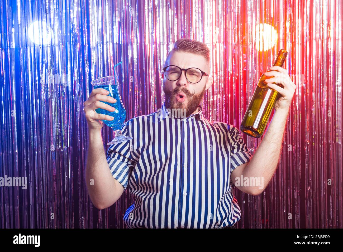 Alcoholism, fun and fool concept - Drunk crazy guy at party in a ...