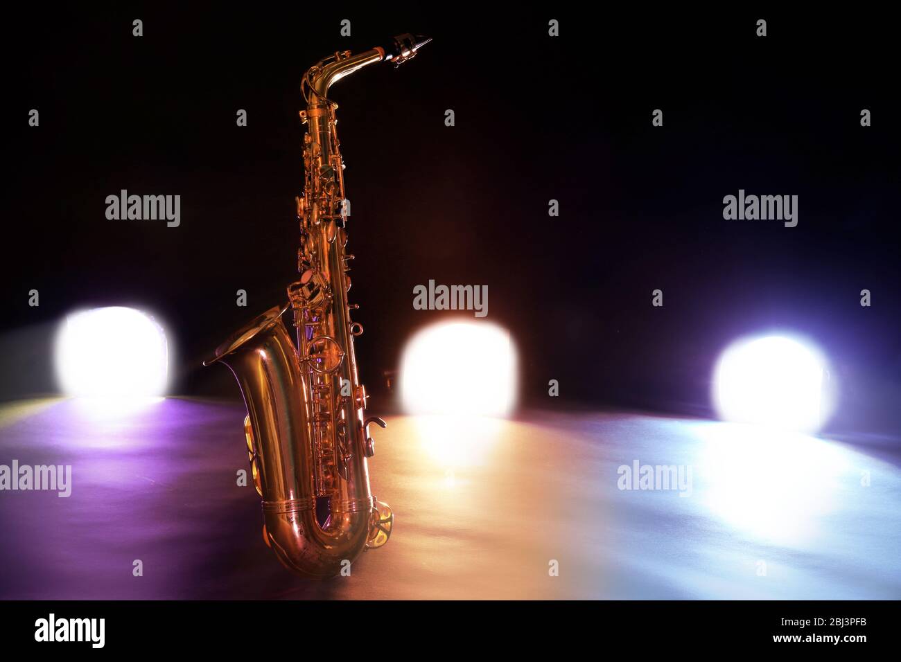 Beautiful golden saxophone on a scene Stock Photo - Alamy