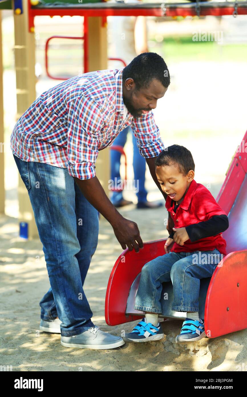 Father and son playing on the children playground Stock Photo - Alamy