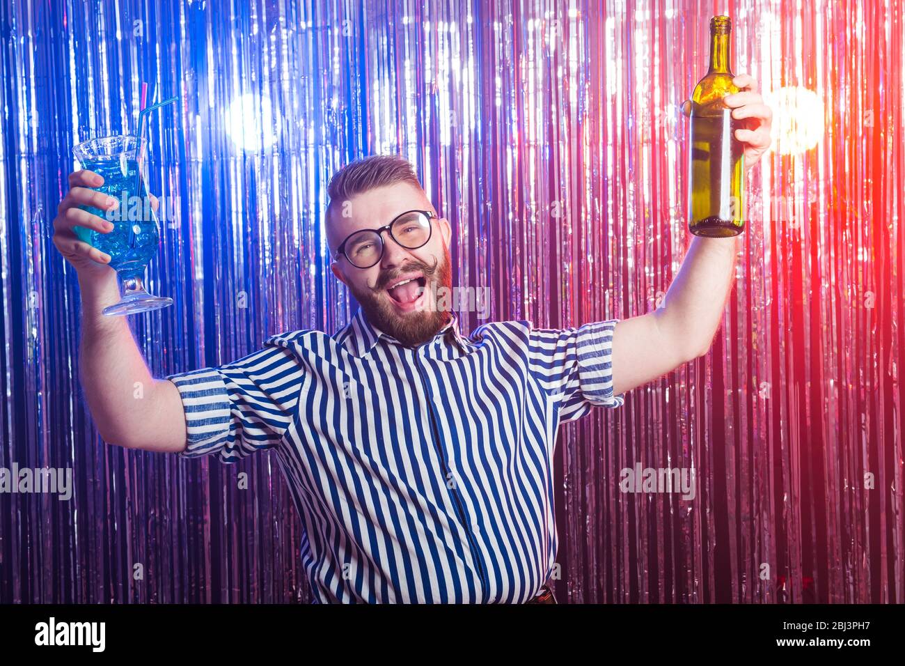Alcoholism, fun and fool concept - Drunk crazy guy at party in a ...