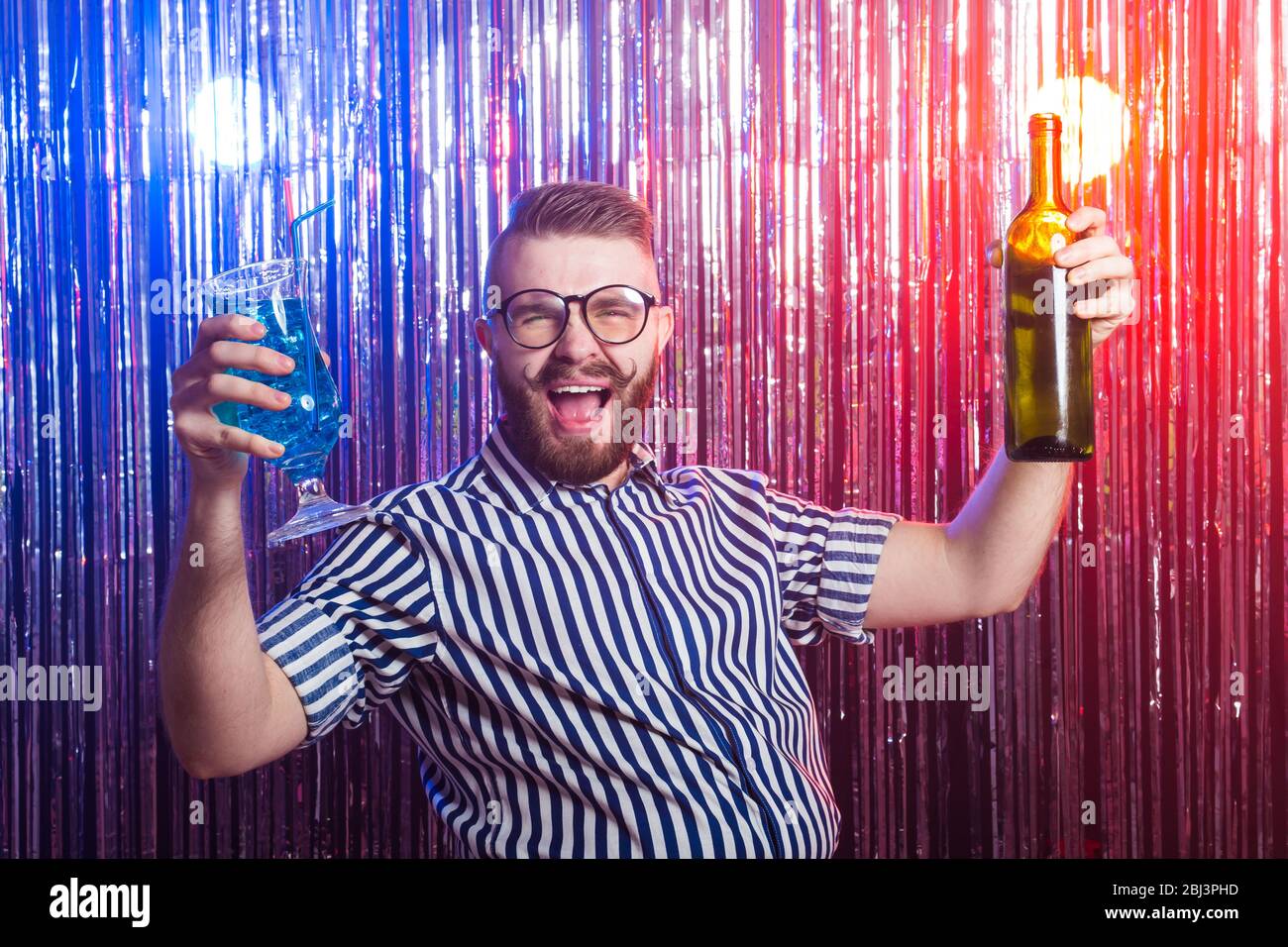 Alcoholism, fun and fool concept - Drunk crazy guy at party in a ...