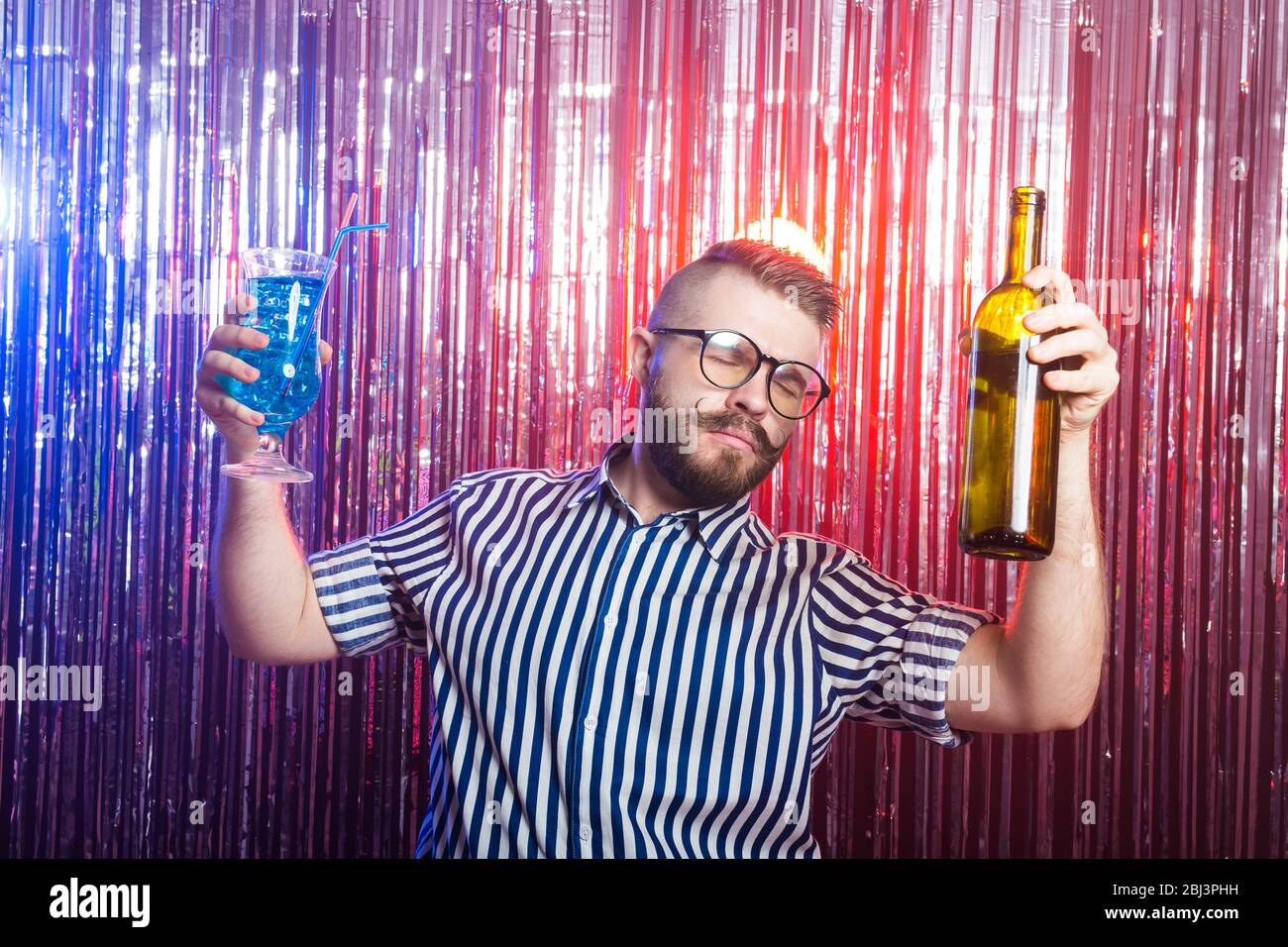 Alcoholism, fun and fool concept - Drunk funny guy at party in a ...