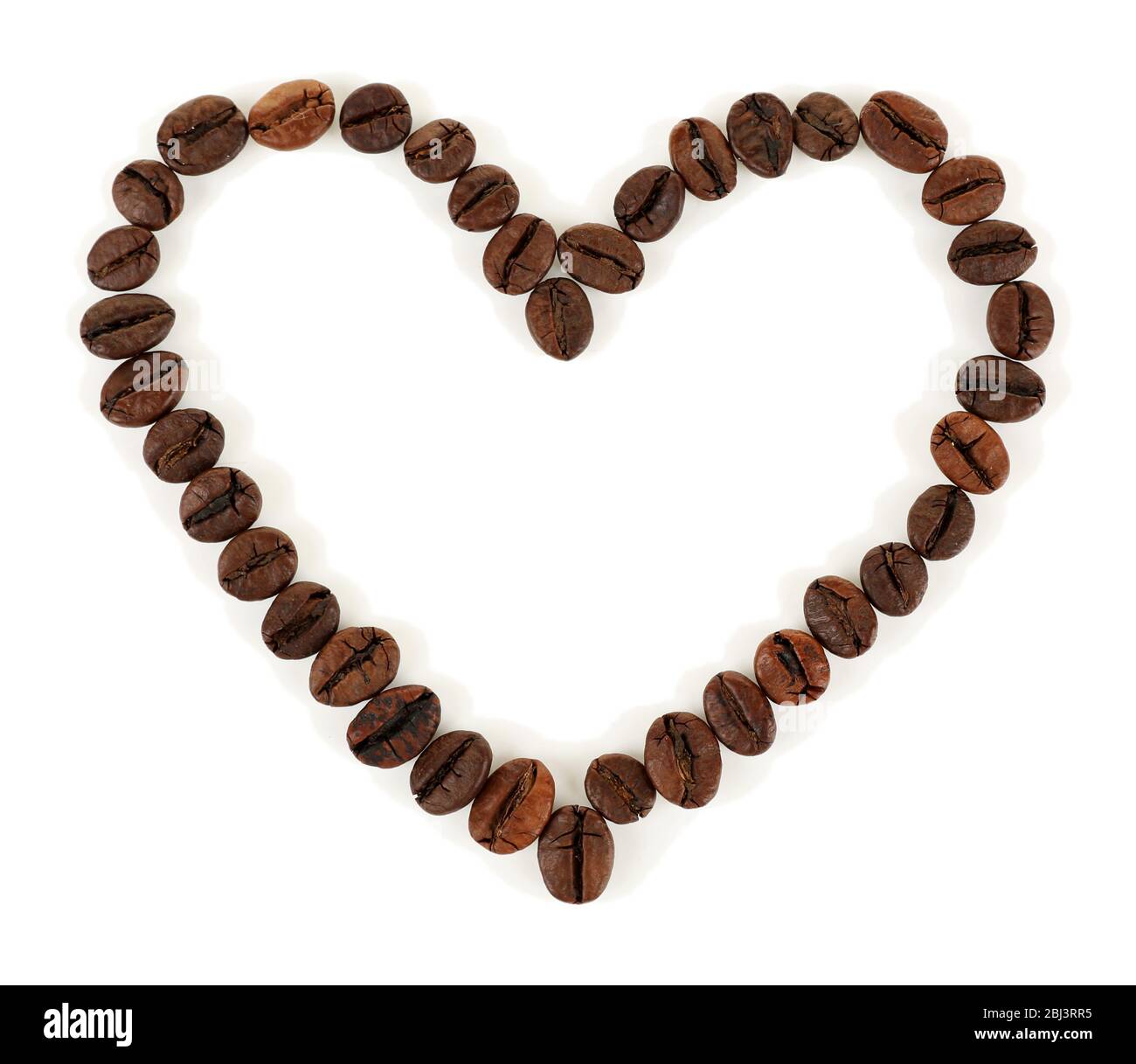 Heart shaped coffee beans isolated on white Stock Photo - Alamy