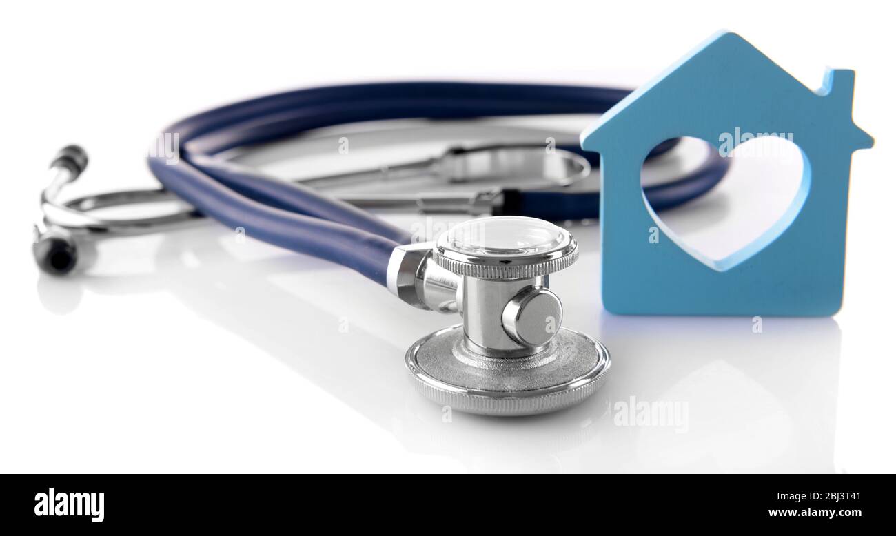 Concept of family medicine - blue plastic house with heart shaped ...